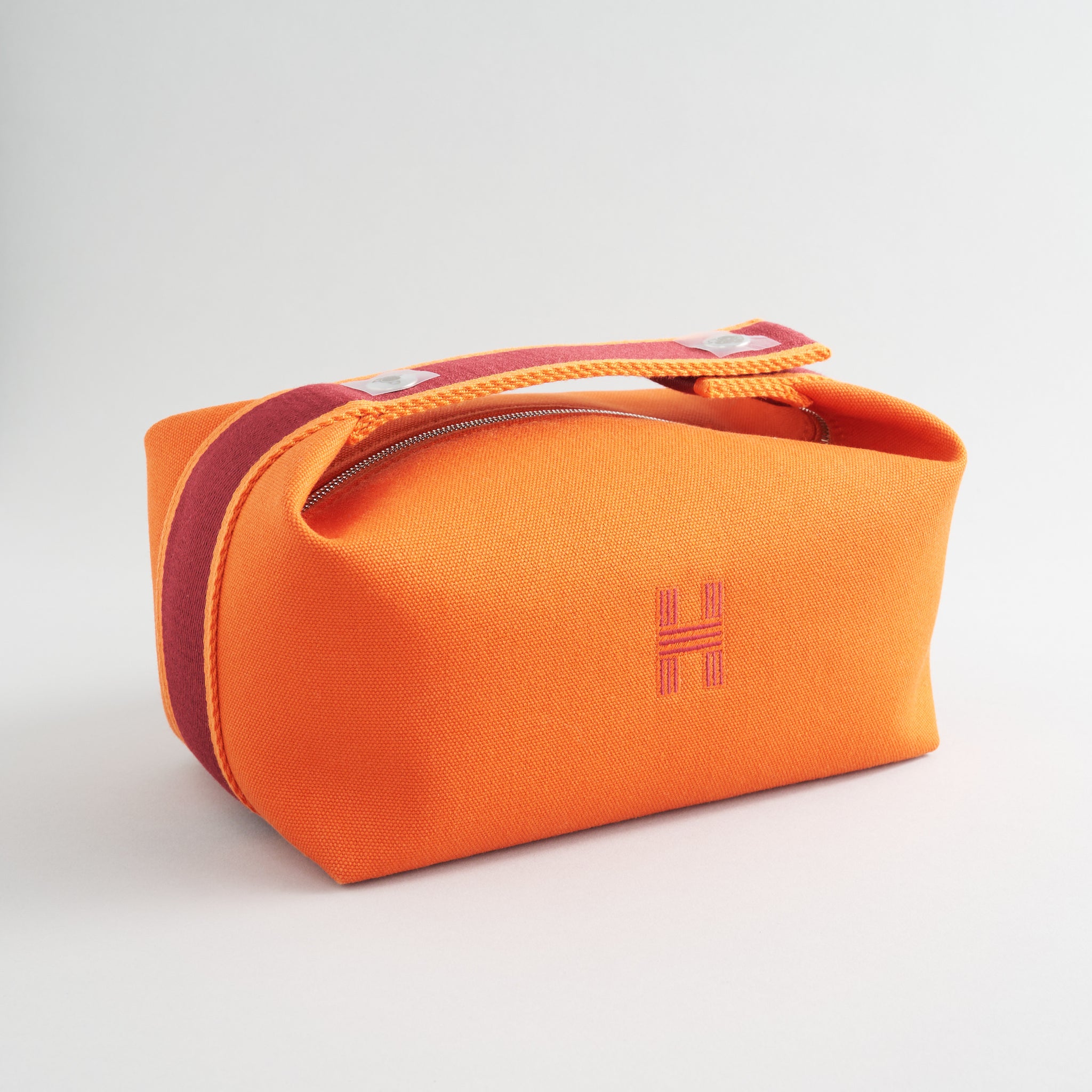 Hermès Bride De Brac Toiletry Bag PM Canvas Orange Feu Palladium Hardw